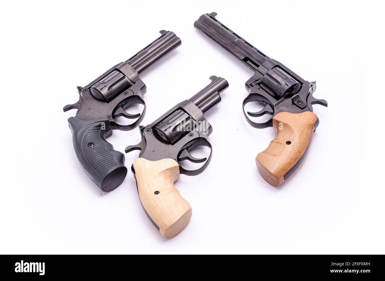 three revolvers with gun drums isolated on white Stock Photo - Alamy