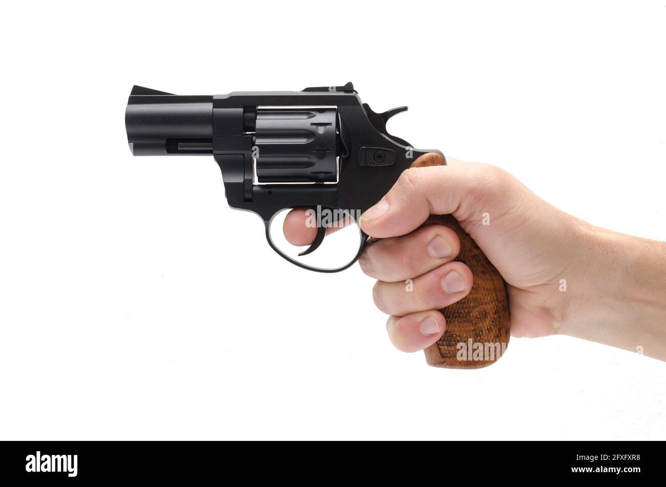 Revolver gun in hand on Cut Out Stock Images & Pictures - Alamy