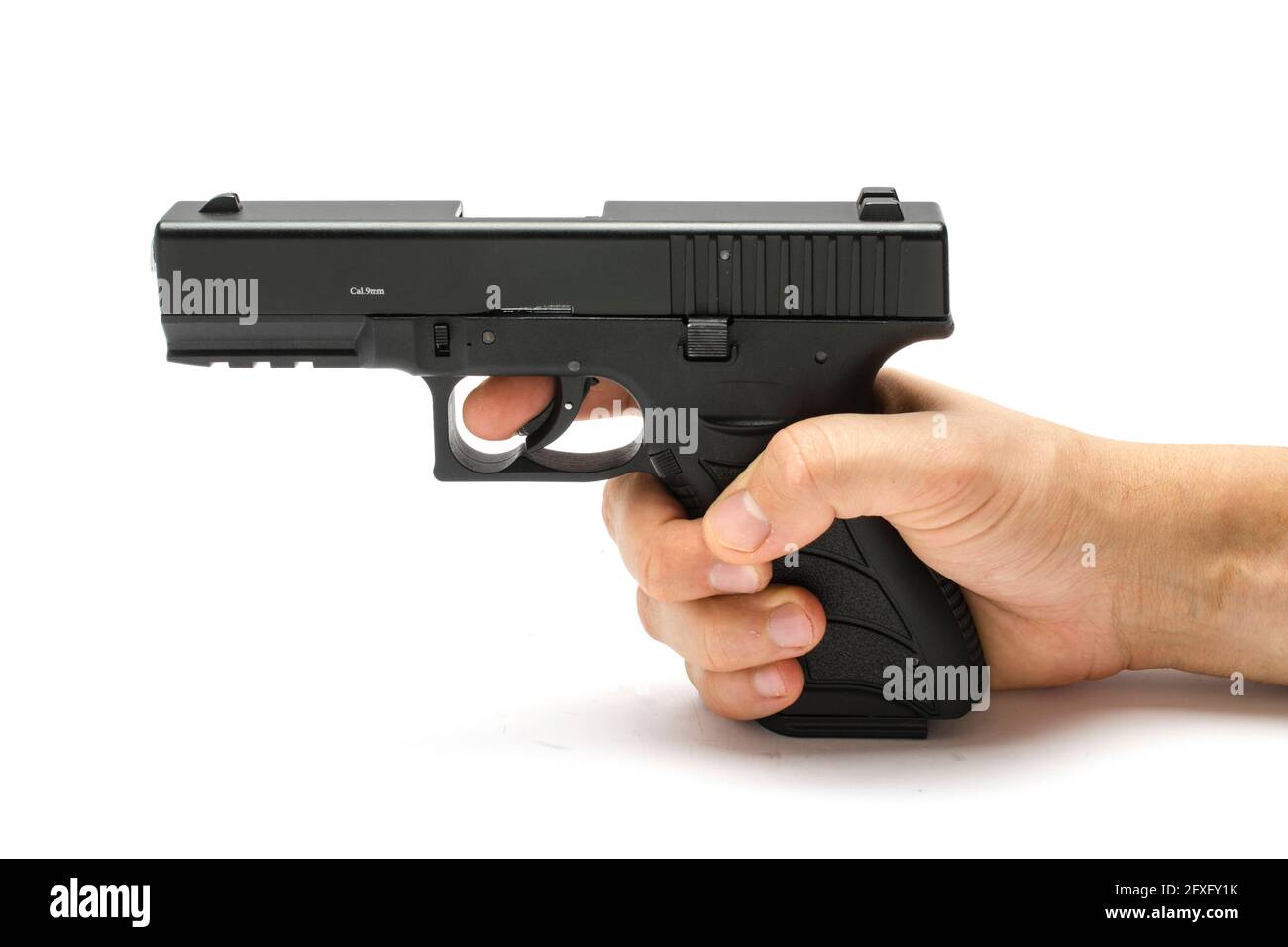 Gun, pistol in hand isolated on white Stock Photo - Alamy