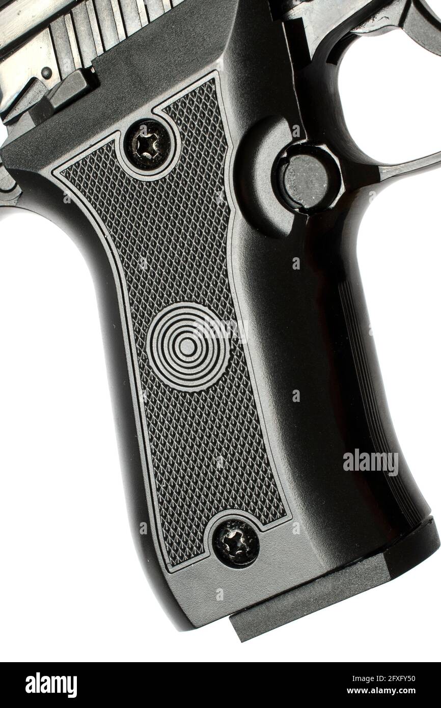 black plastic handle of pistol isolated Stock Photo - Alamy