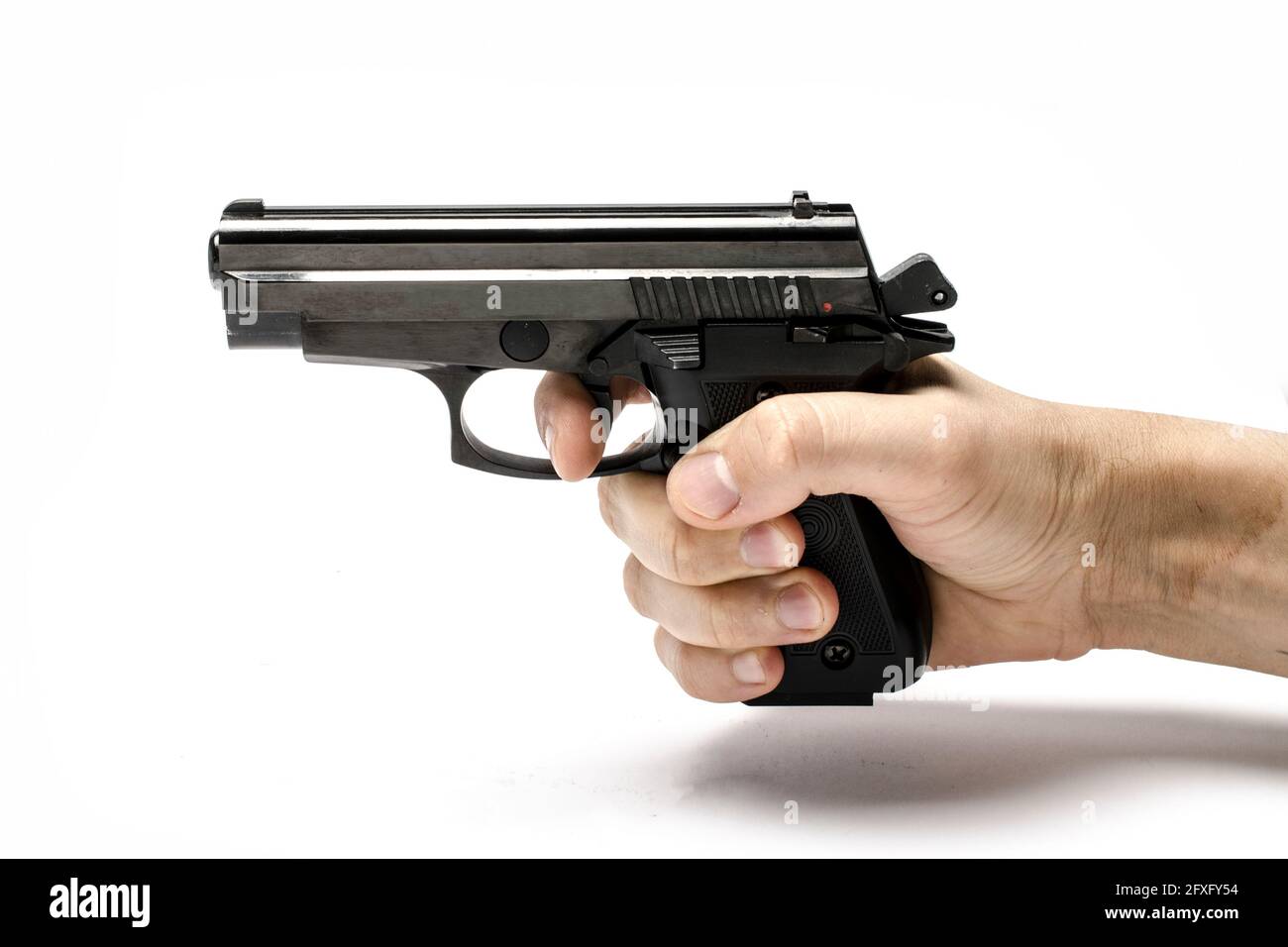 Gun, pistol in hand isolated on white Stock Photo - Alamy