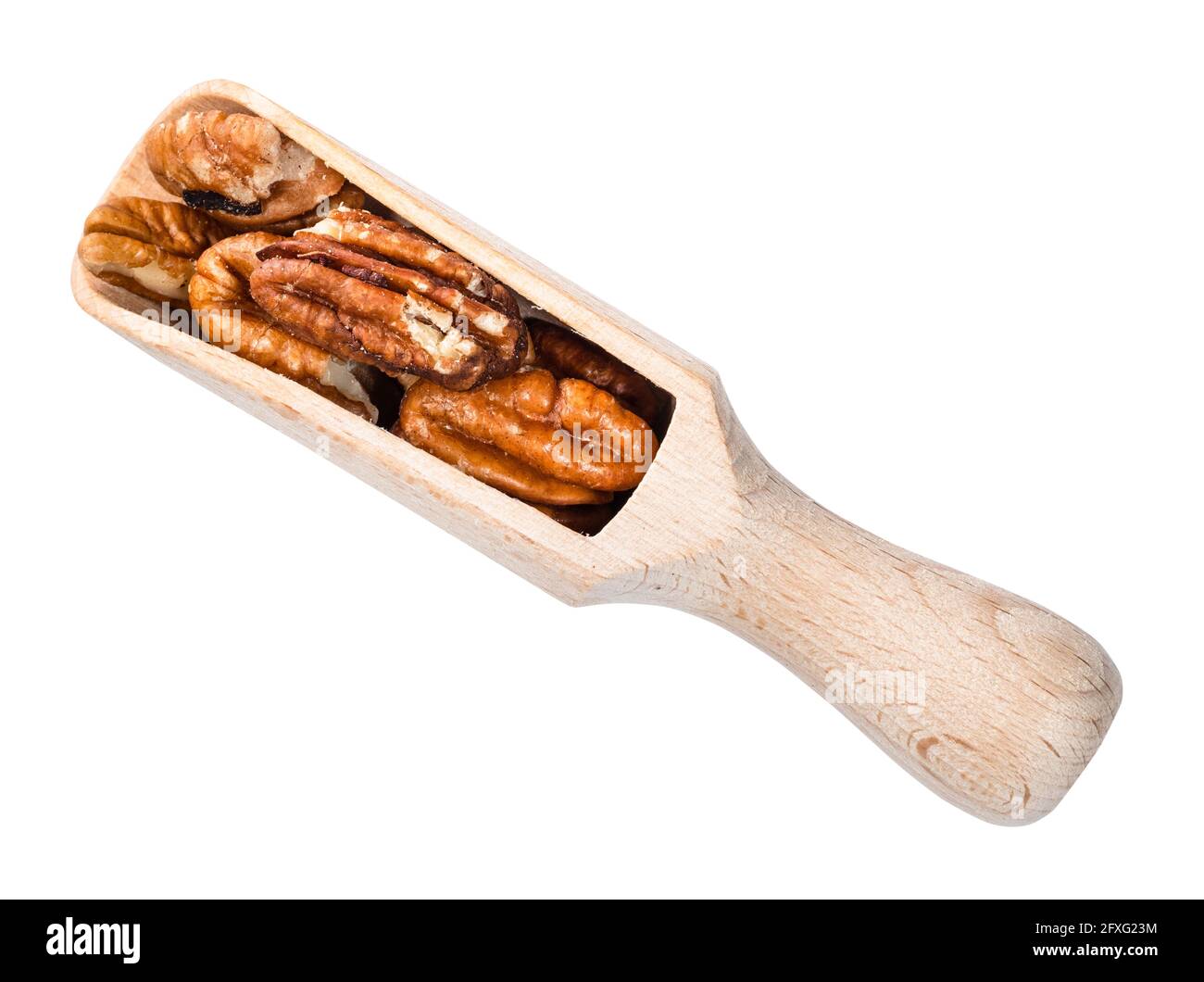 top view of shelled pecan nuts in wooden scoop cutout on white ...