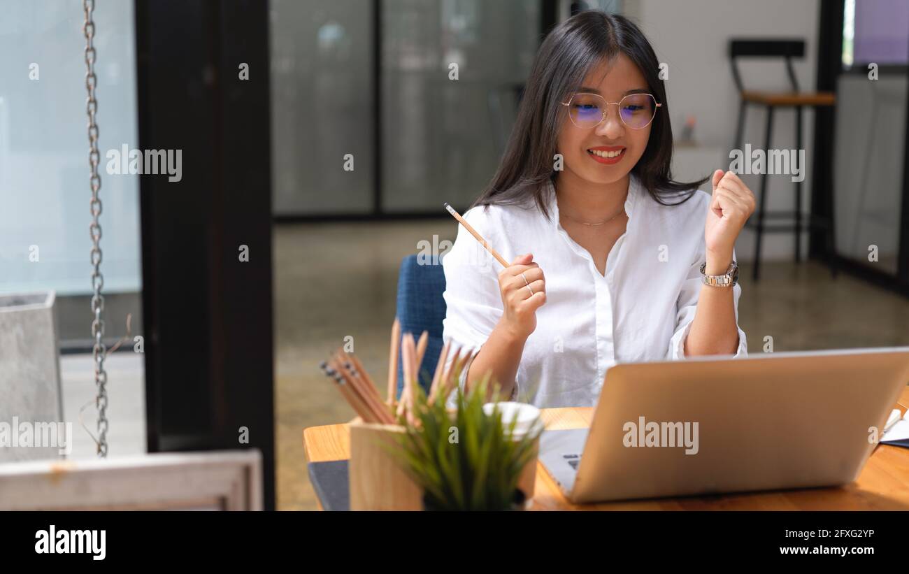 Young businesswoman getting exited after hearing a good news on her ...