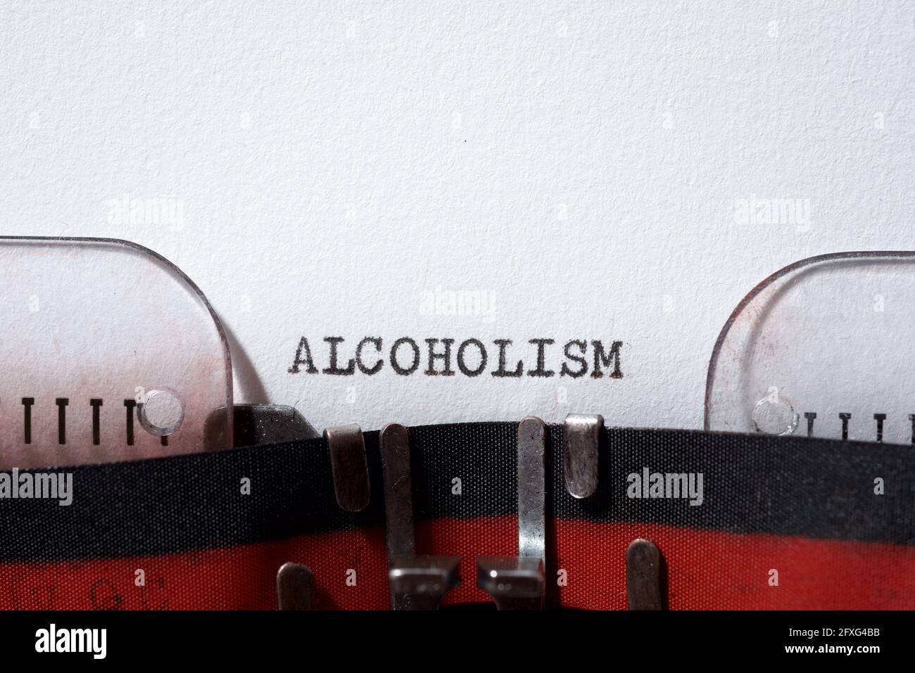 Alcoholism word written with a typewriter Stock Photo - Alamy