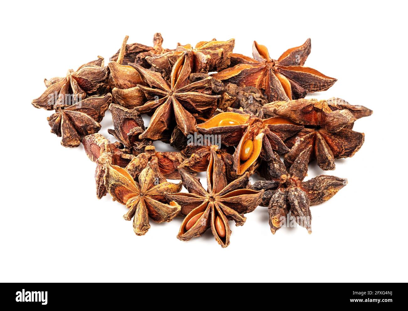 handful of star anise (badian) fruits and seeds closeup on white ...