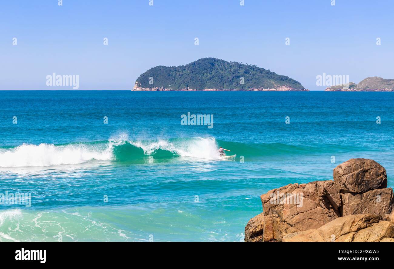 Beautiful view of a man surfing in the ocean in Brazil Stock Photo - Alamy