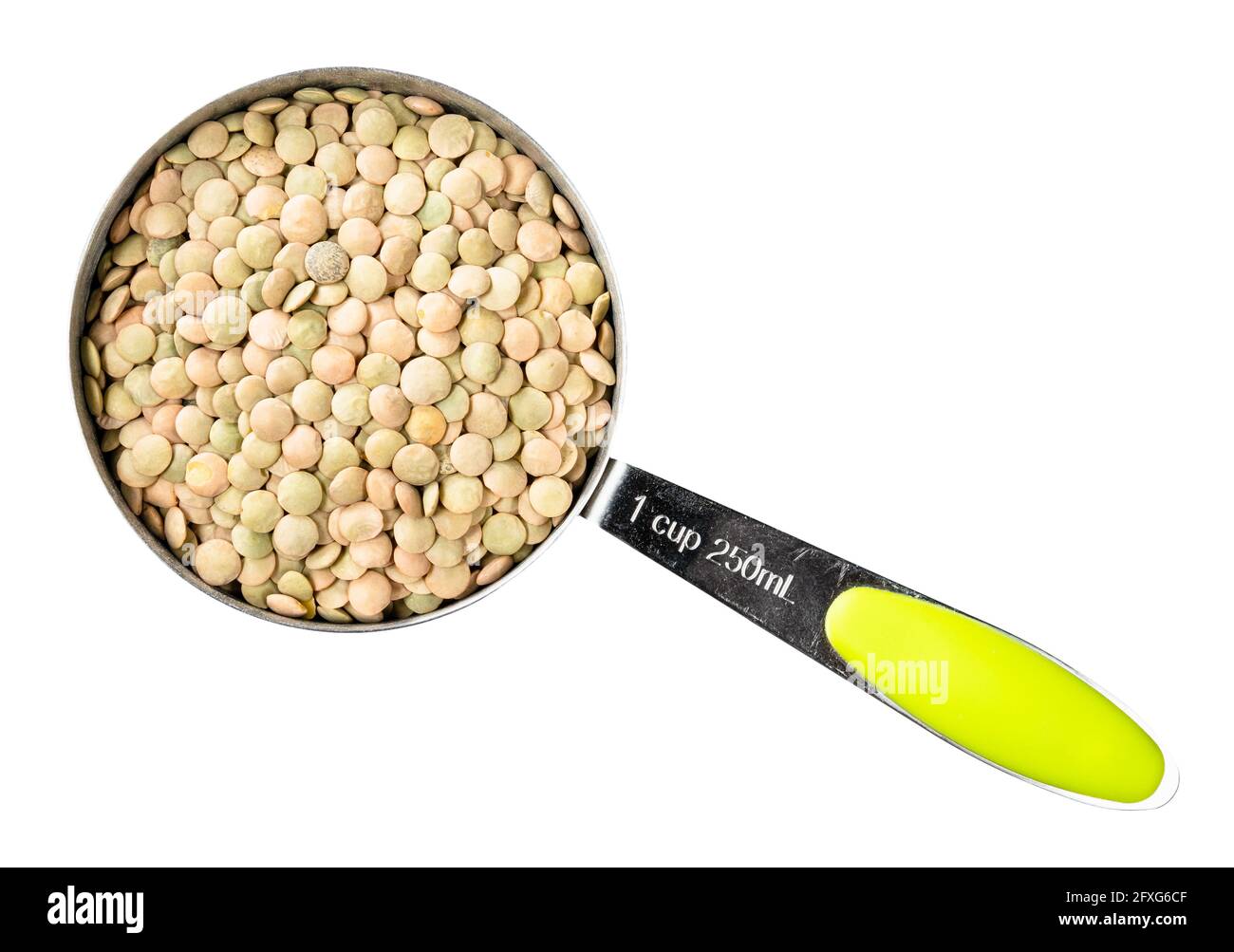 top view of whole large green lentils in measuring cup cutout on white ...