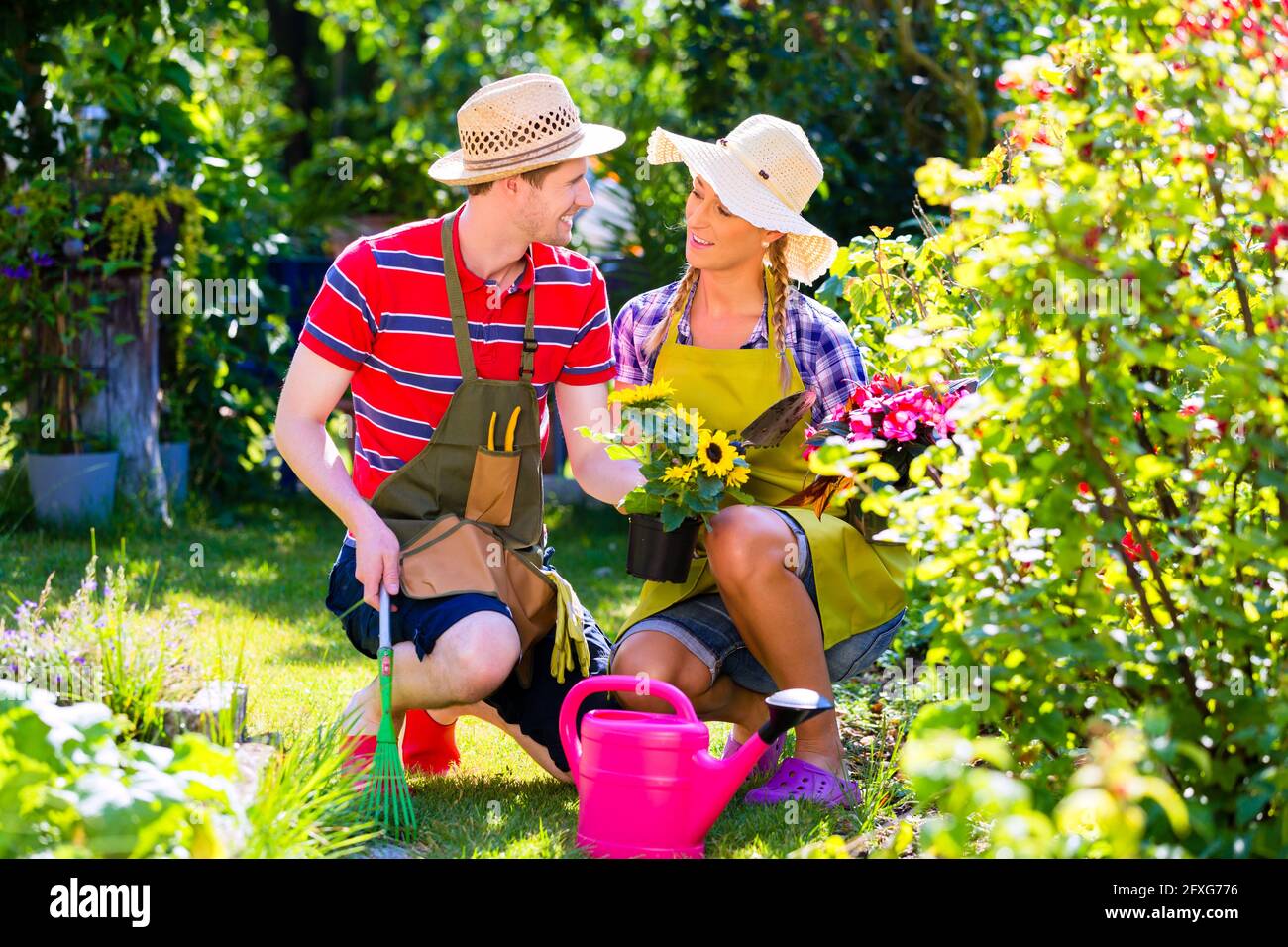Planting flowers couple hi-res stock photography and images - Alamy