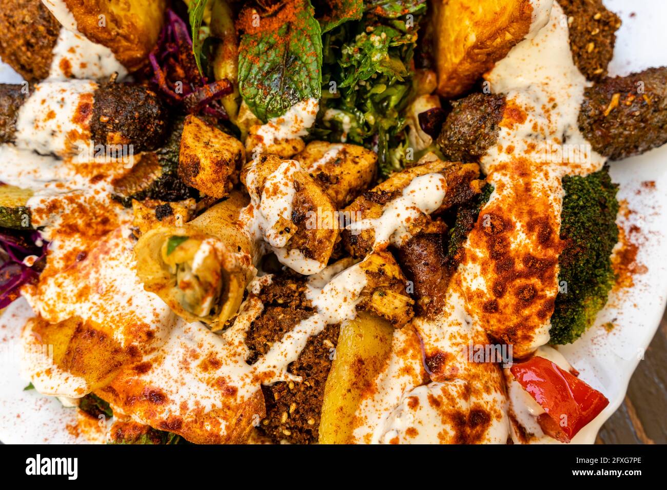 A mixed plate of Arabic Lebanese food including falafel, halloumi ...