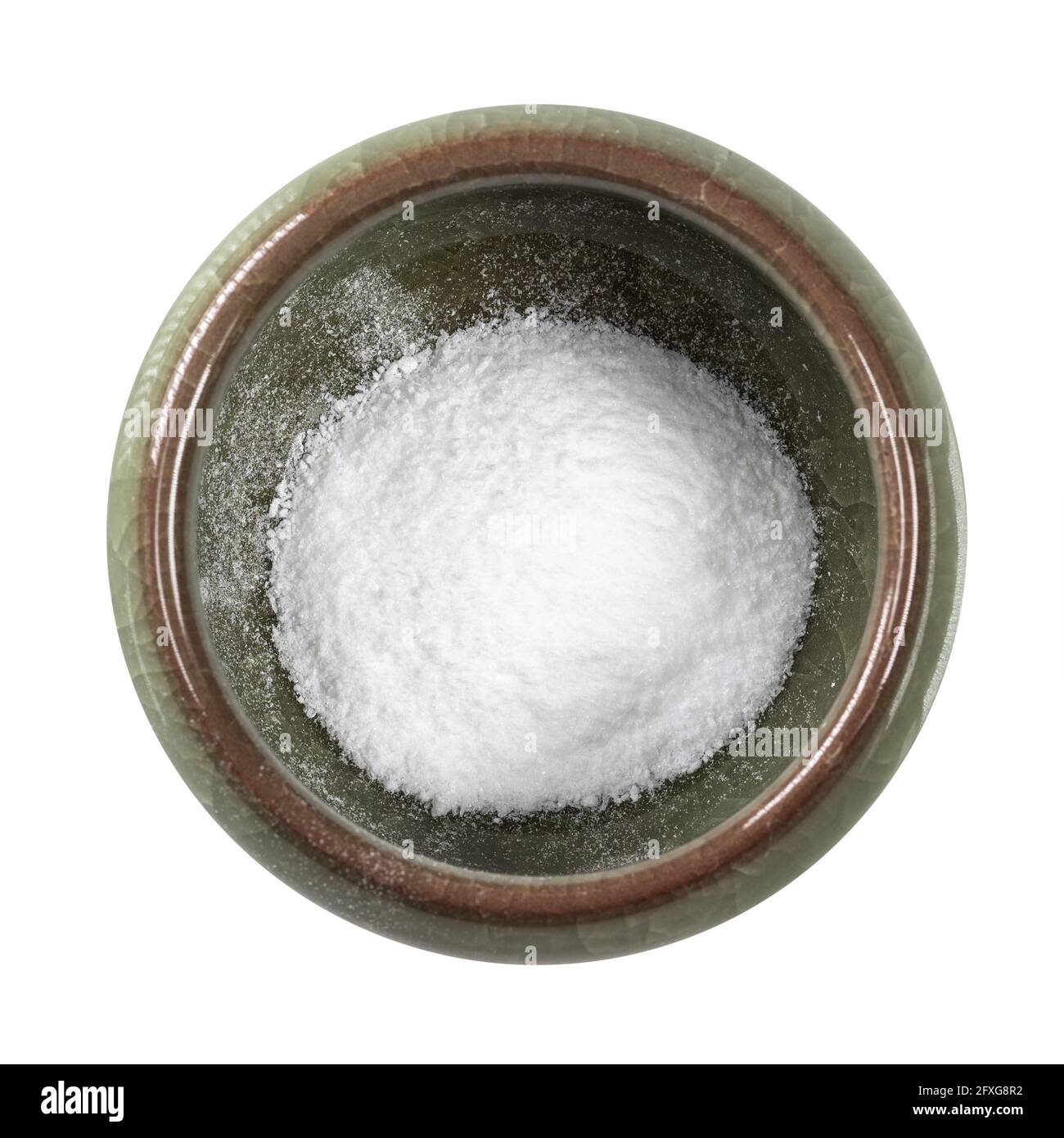 top view of vanillin powder in round ceramic bowl cutout on white ...