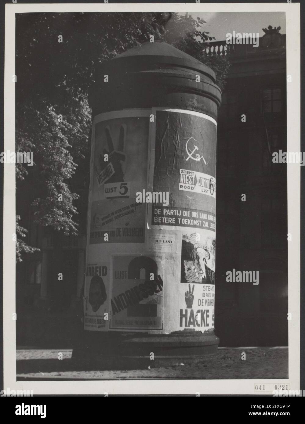Elections 1946. Advertising column (peperbus) with election posters in ...