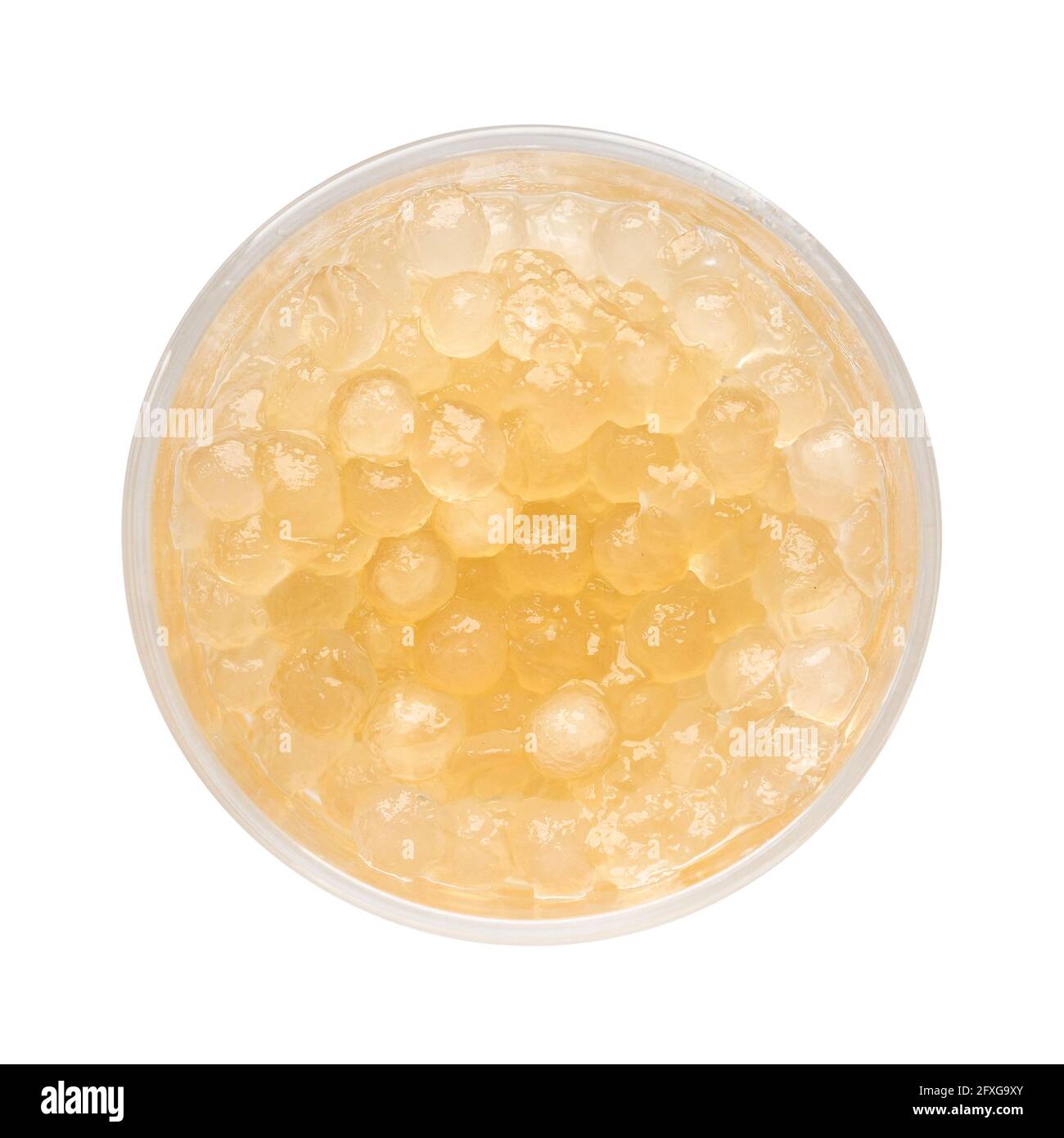 top view of boiled tapioca balls in glass bowl cutout on white ...