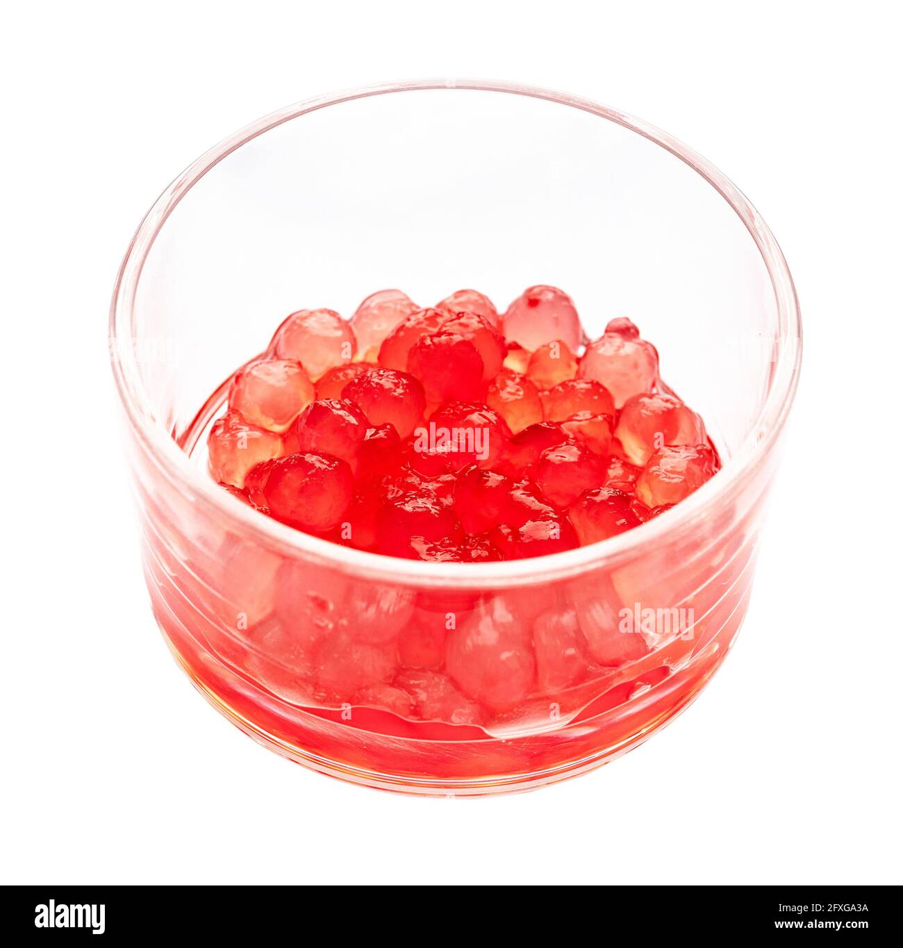 red colored boiled tapioca balls in glass bowl cutout on white ...