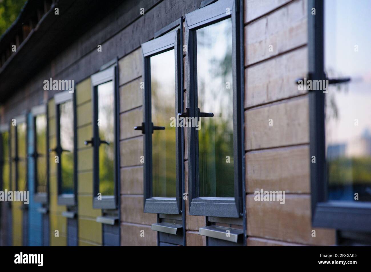 Windows of the stable boxes in perspective Stock Photo - Alamy