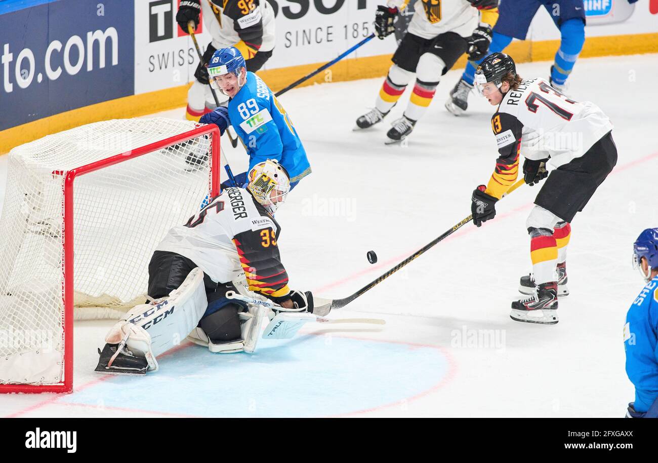 Mathias Niederberger #35 goalie of Germany Lukas Reichel #73 of Germany Anton Sagadeyev #89 of ...