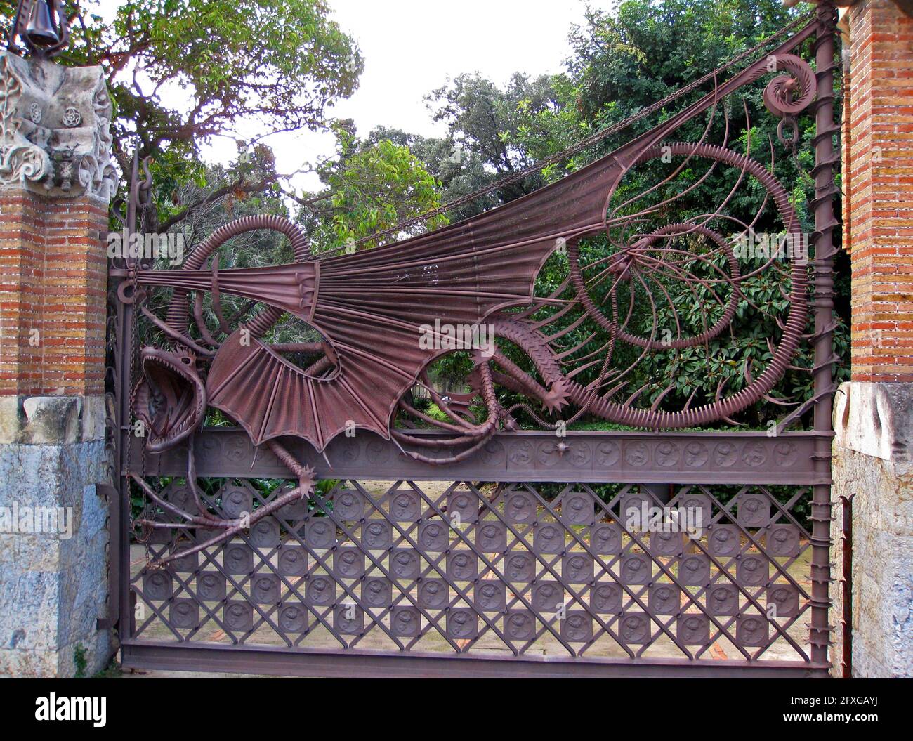 Barcelona: Gaudi's dragon gate to the Pavellons Güell Stock Photo - Alamy