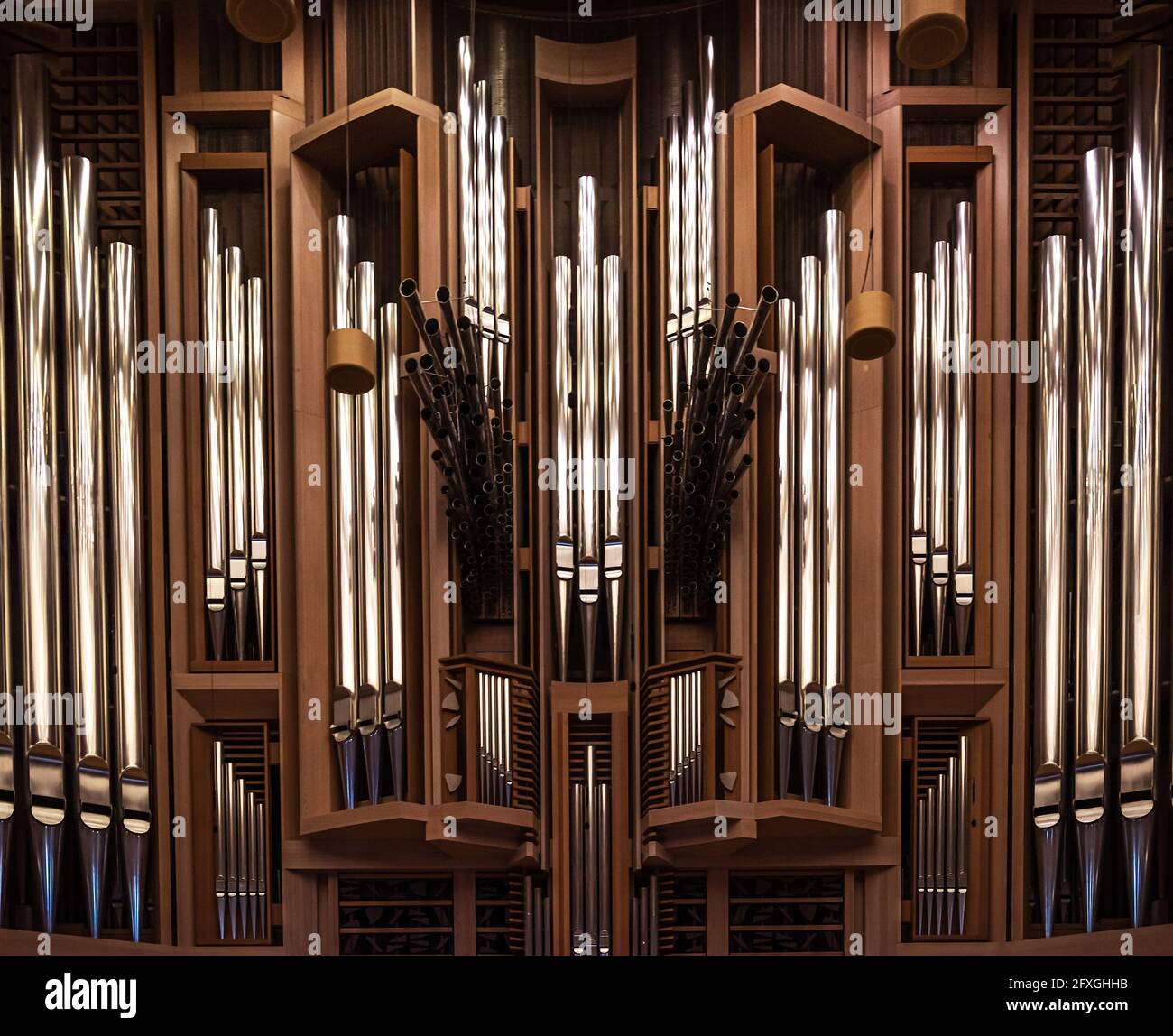 Pipes of old organ by wall in hall of catholic church Stock Photo - Alamy