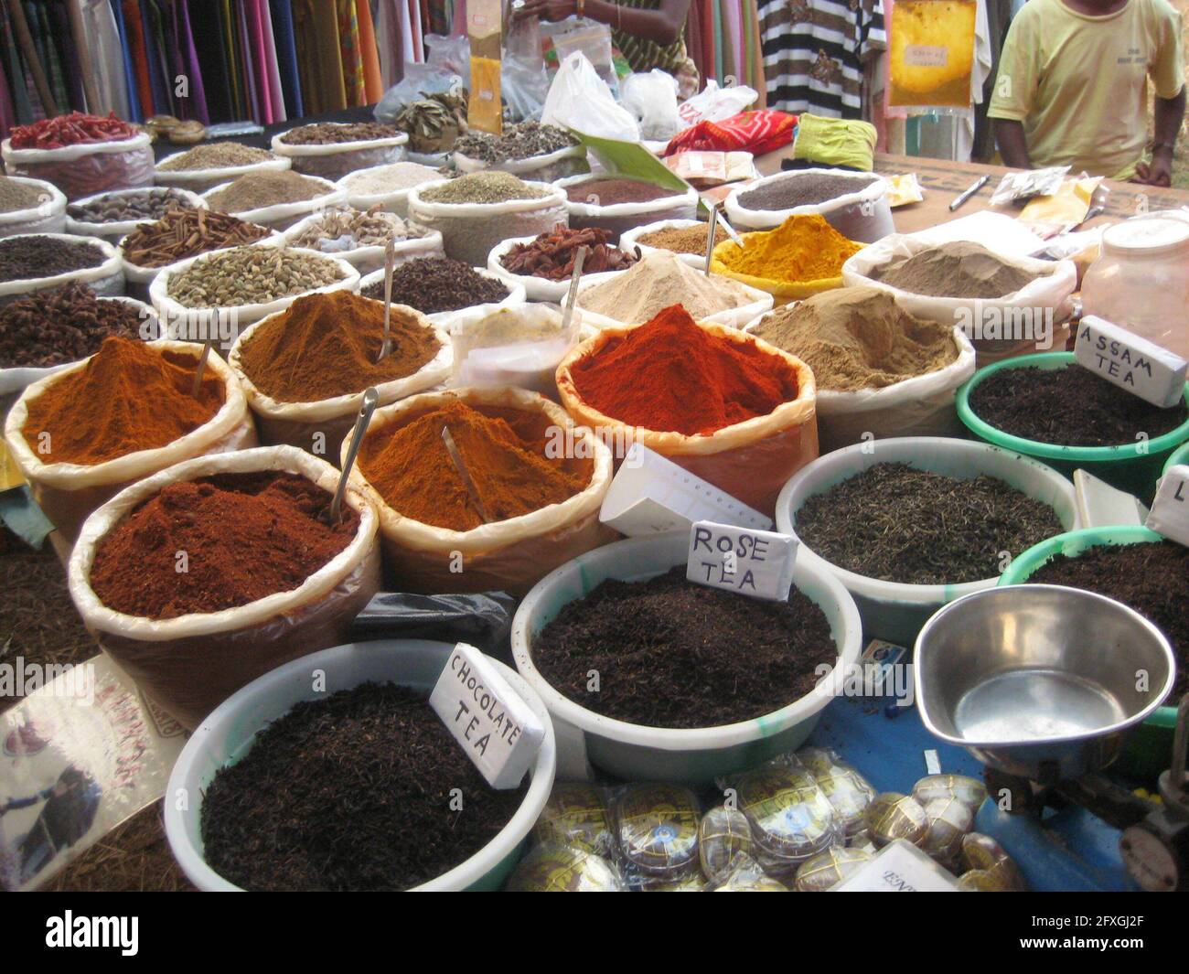 Marketplace in India with various flavors of tea powder in plastic bags ...