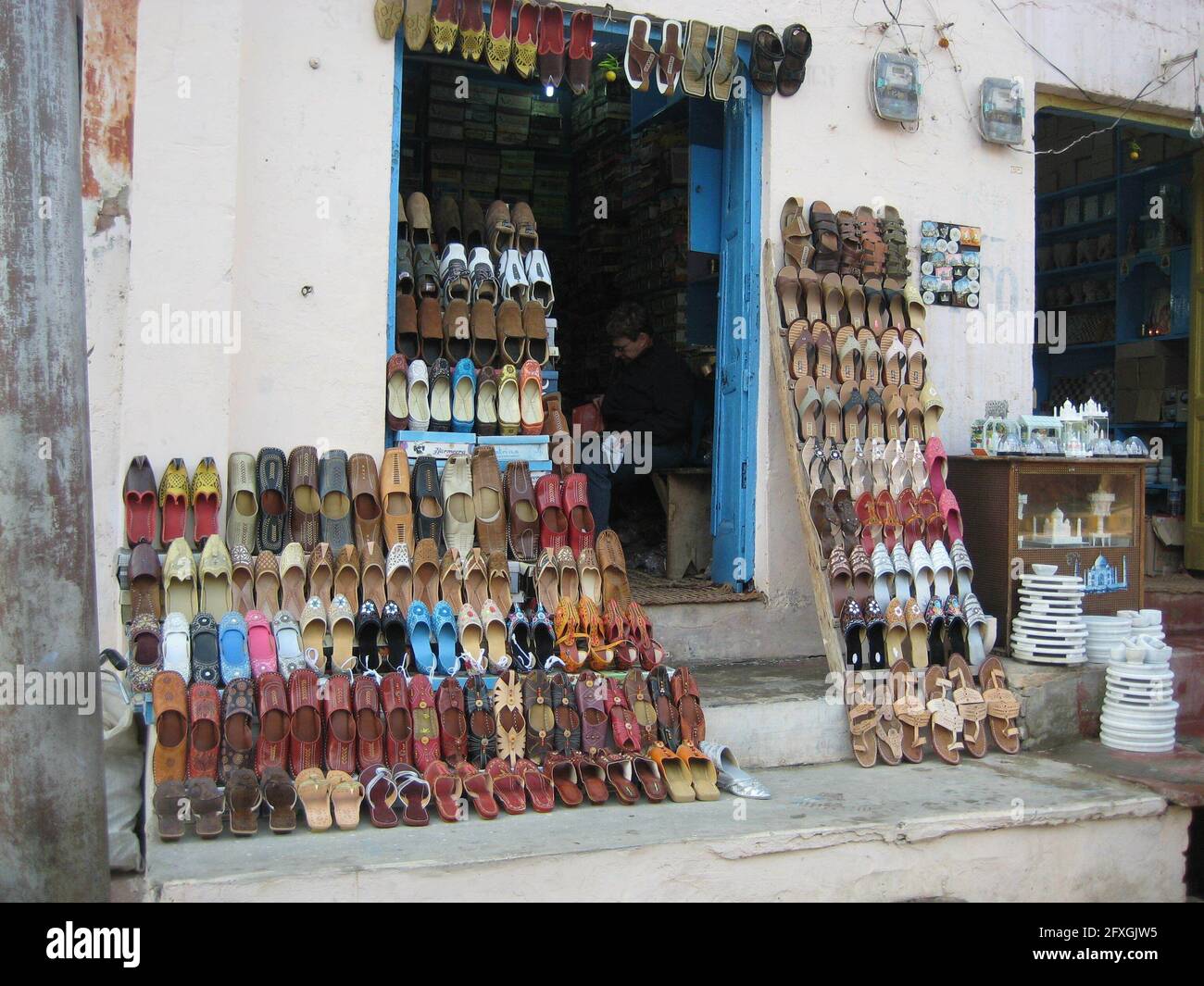 Small shop in the street with handcrafted leather shoes on display ...