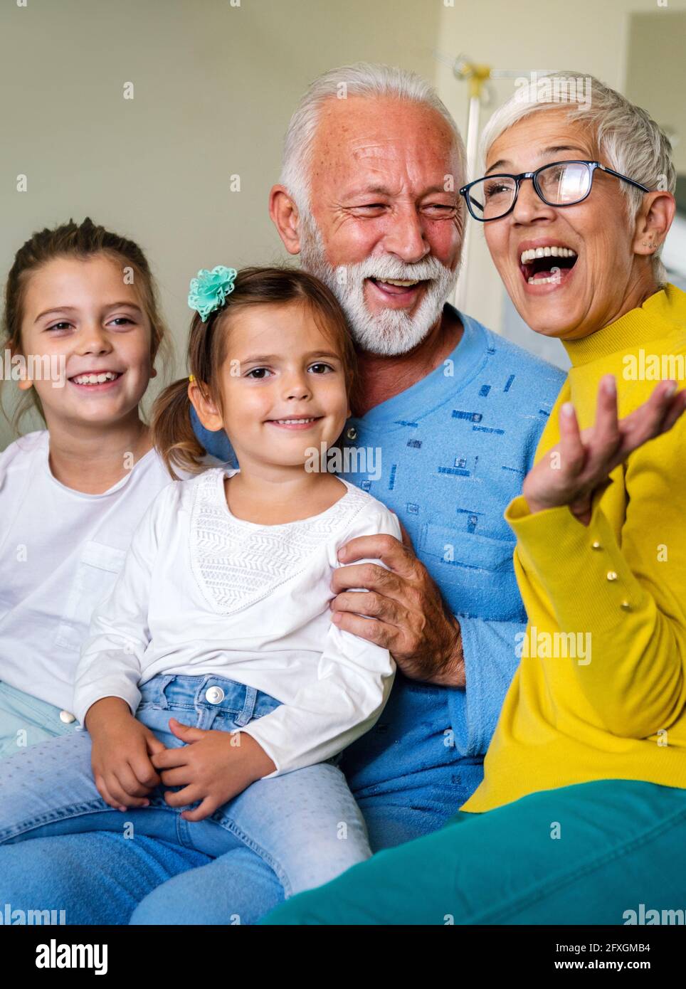 Family visiting senior male patient in hospital bed. Healthcare ...