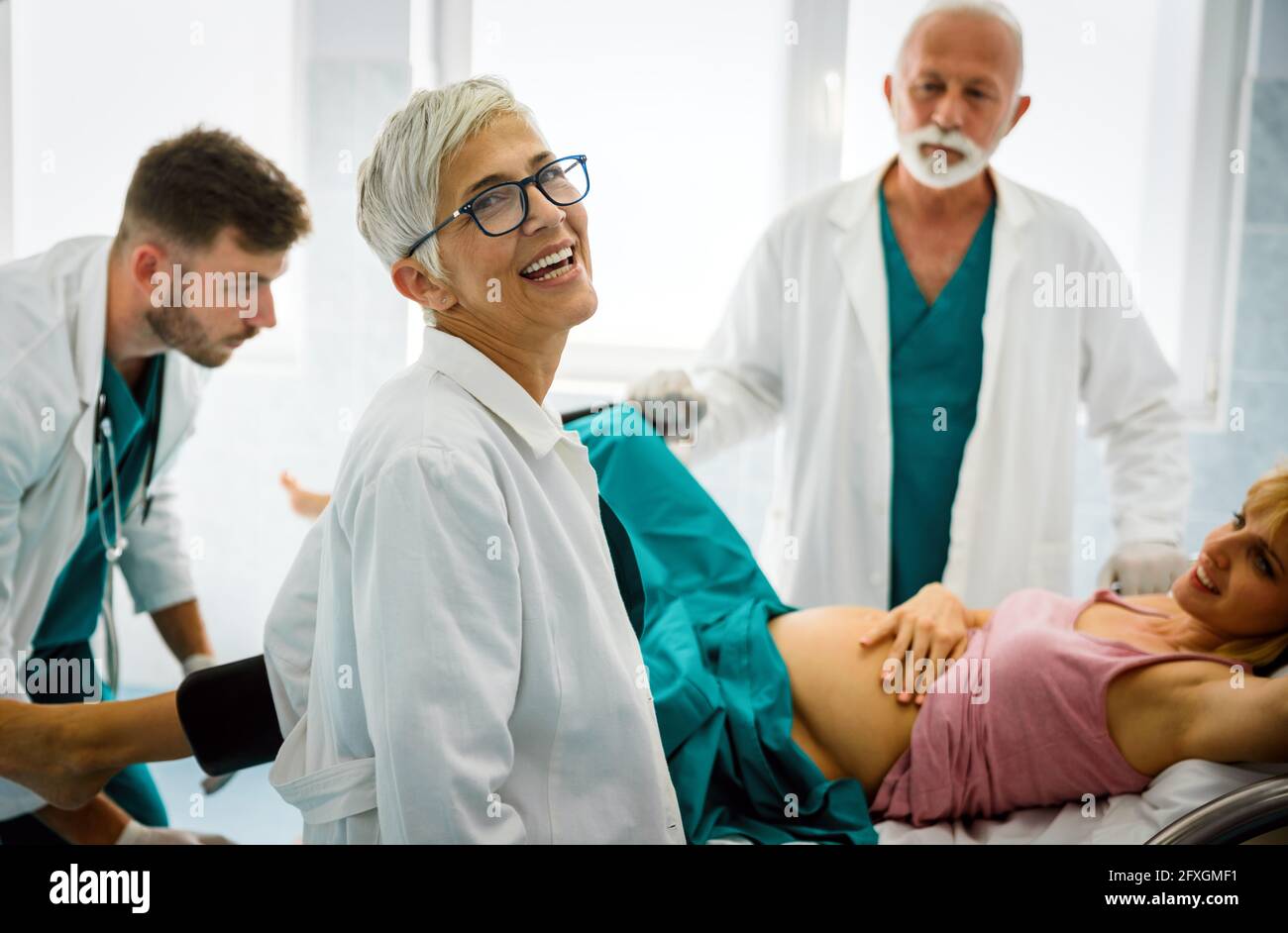 Woman giving birth bed hi-res stock photography and images - Alamy