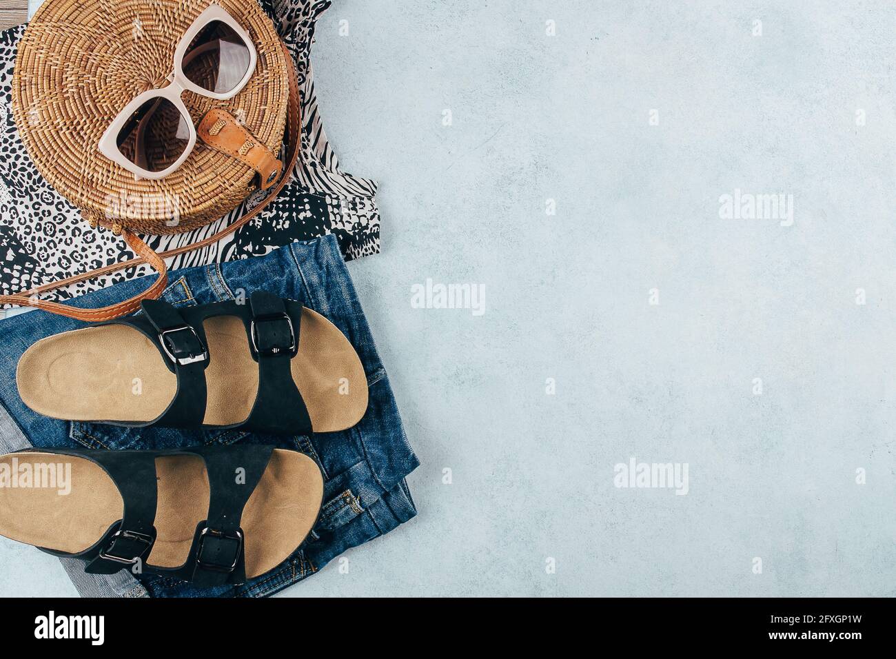 Flat lay with summer women's clothing and accessories. Animal print t ...