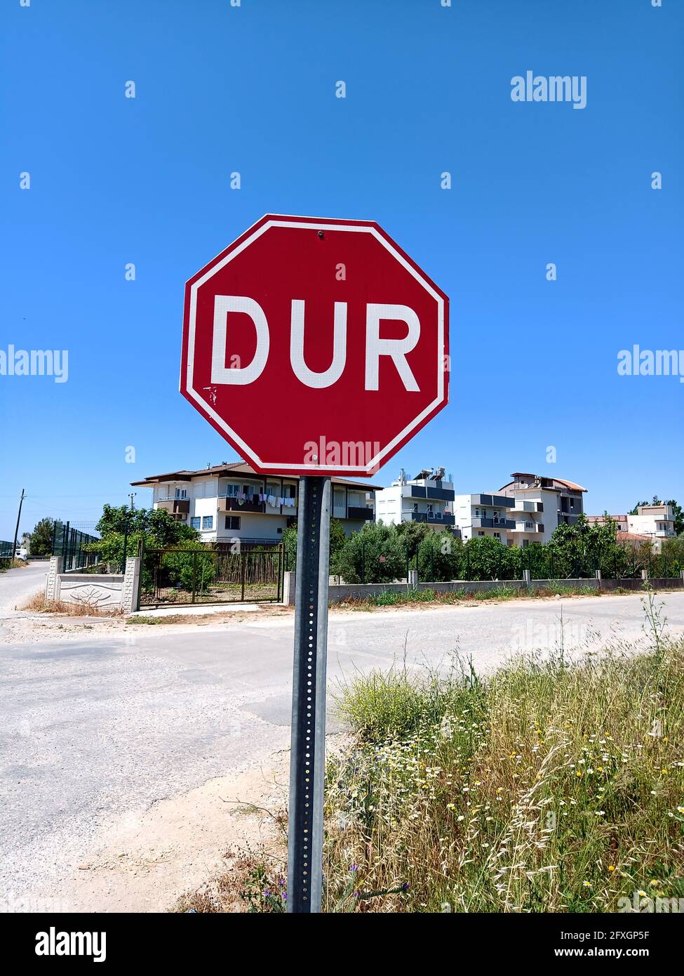 Vertical shot of a red road sign with "DUR" writing Stock Photo - Alamy