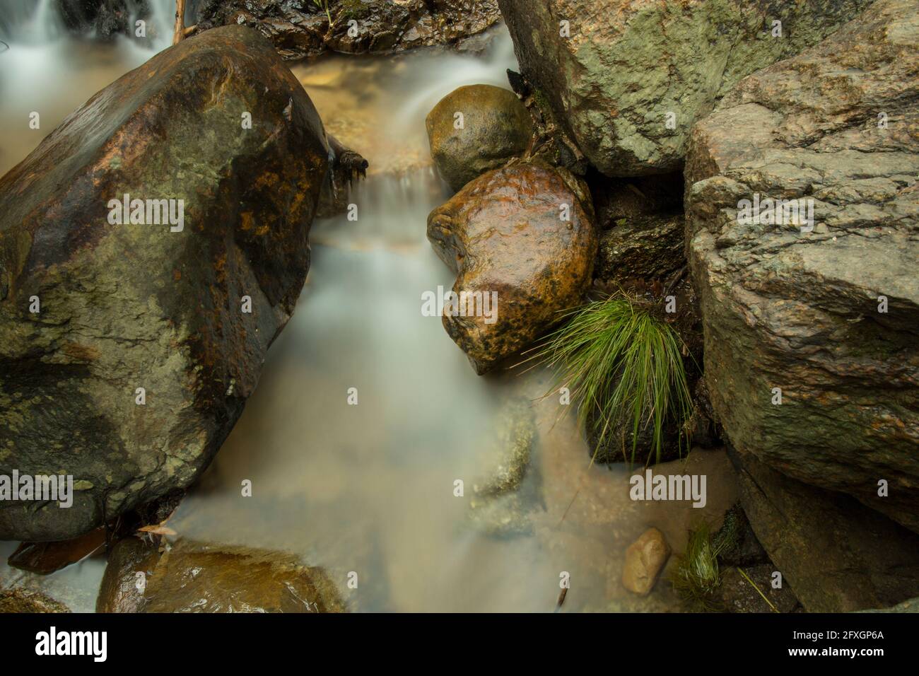 A cascading waterfall in a mountain in the Paarl Region of the Western ...