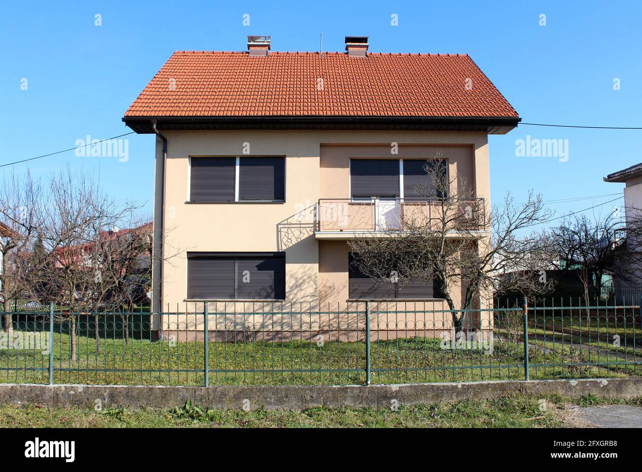 Freshly renovated suburban family house with new facade and roof and ...
