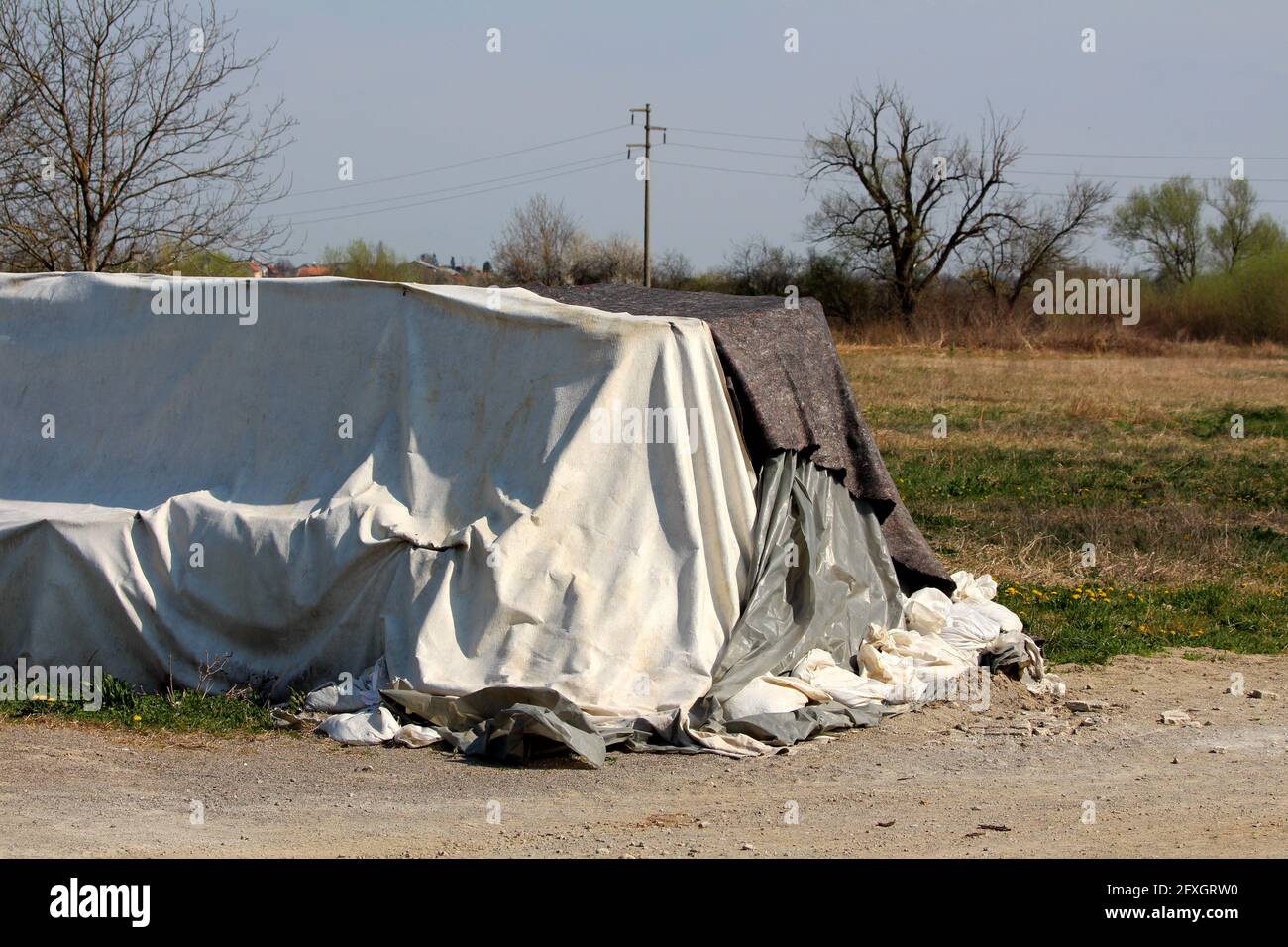 Part of broken old temporary flood protection wall made of box barriers ...