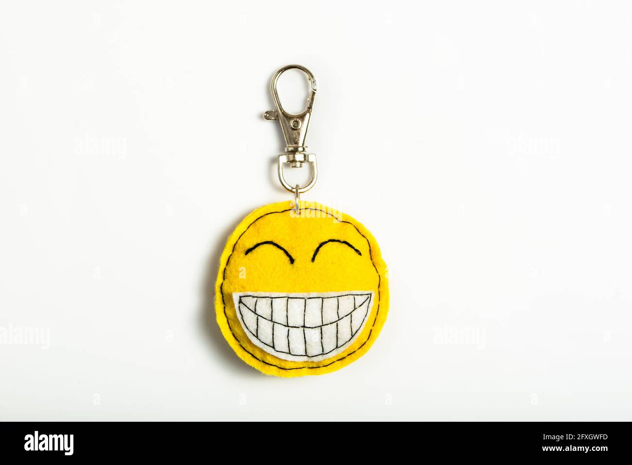 Happy smiley key chain emoticon isolated on white Stock Photo - Alamy