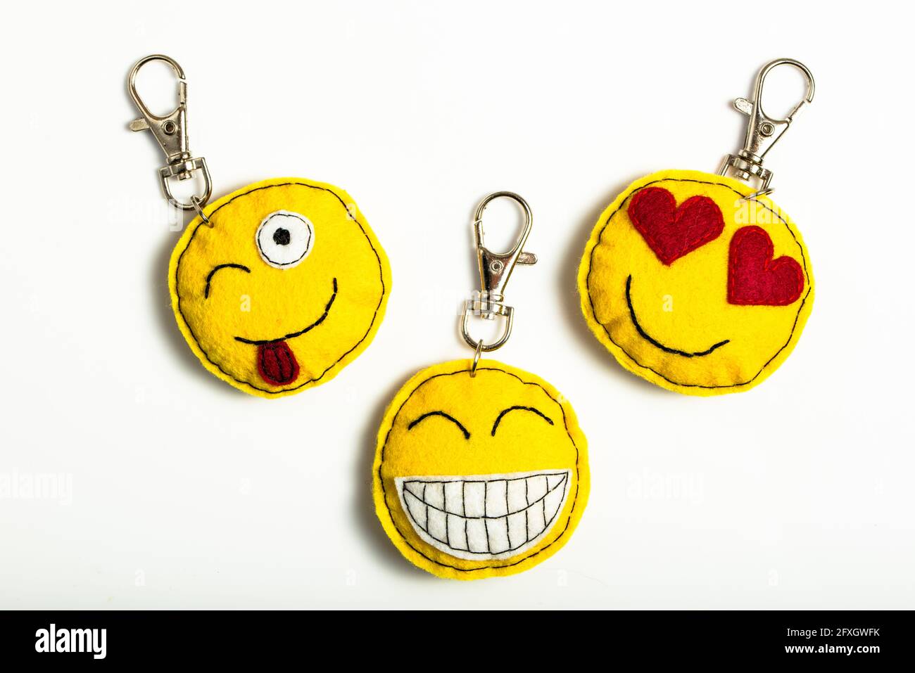 Happy smiley key rings emoticons isolated on white Stock Photo - Alamy