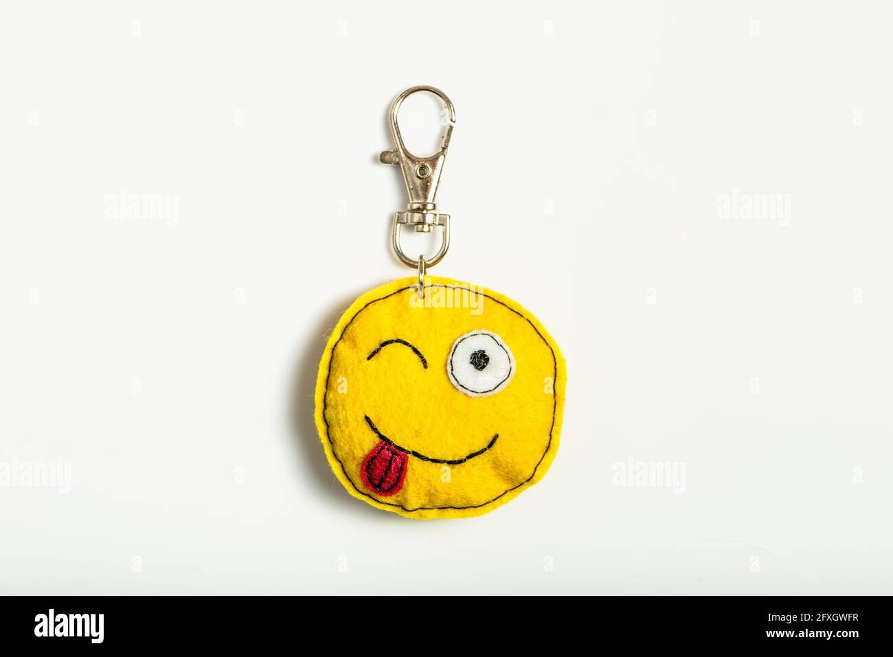 Happy smiley key ring emoticon isolated on white Stock Photo - Alamy