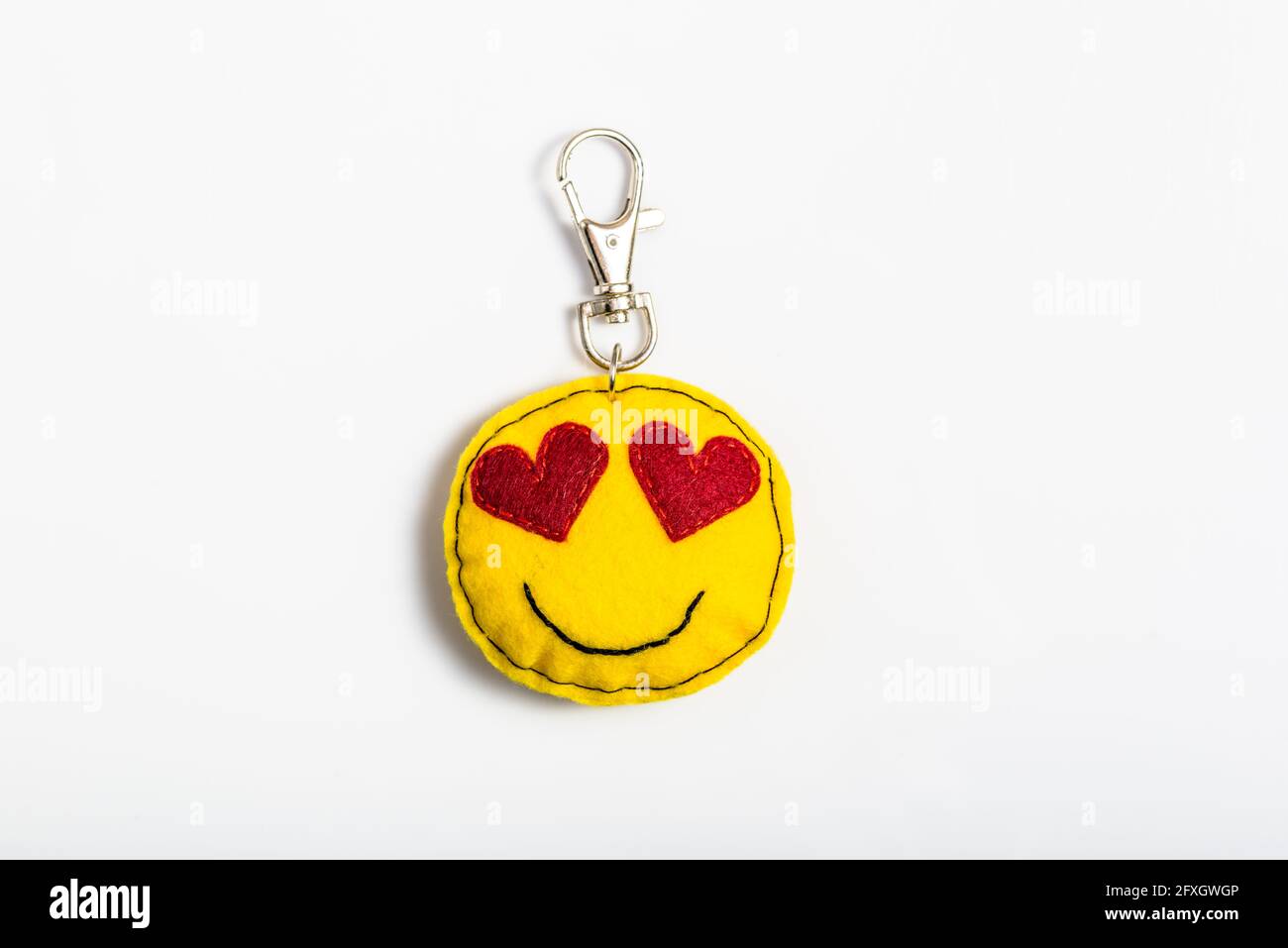 Happy smiley key chain emoticon isolated on white Stock Photo - Alamy
