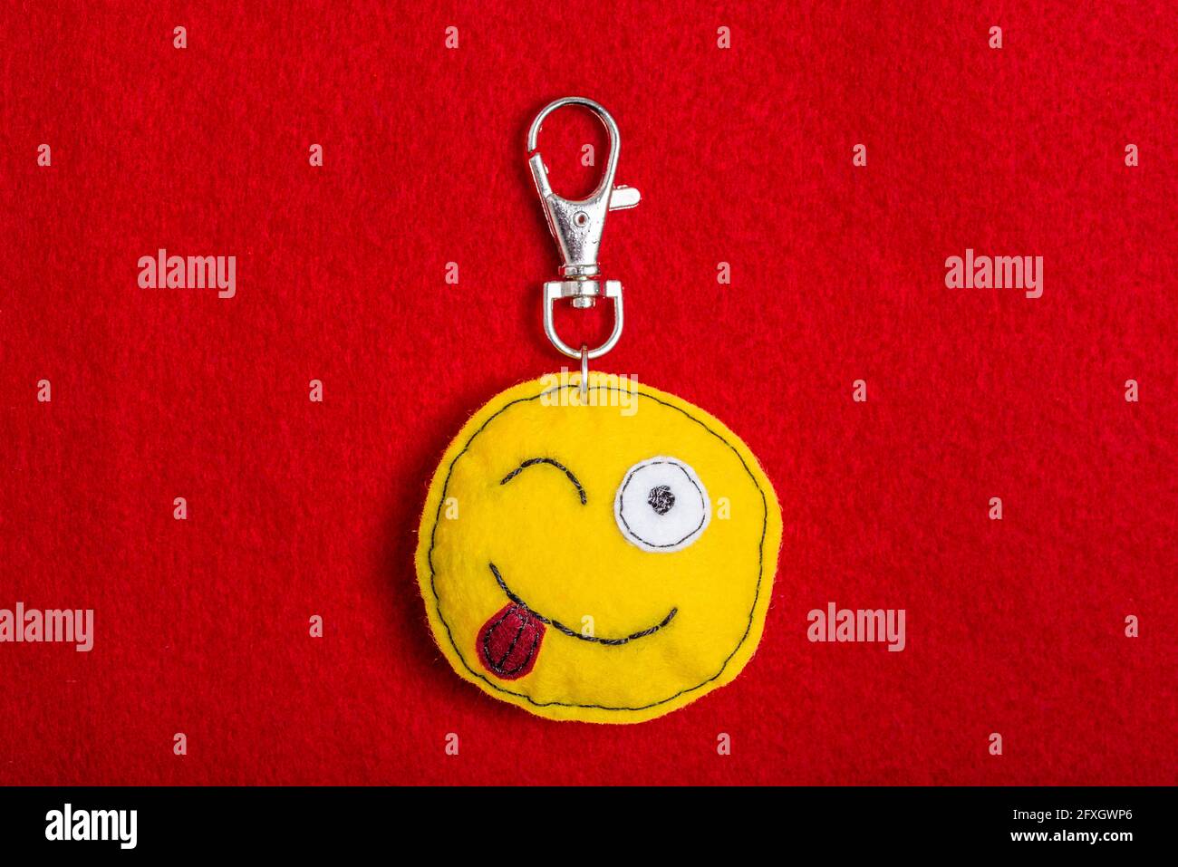 Yellow laughing happy smiley key ring - emoticon Stock Photo - Alamy