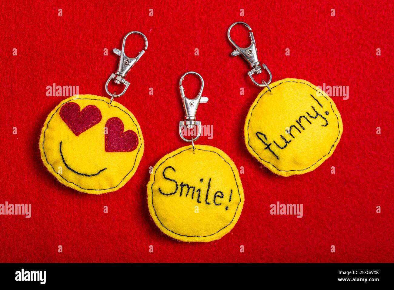 Yellow laughing happy smiley key rings - emoticons Stock Photo - Alamy