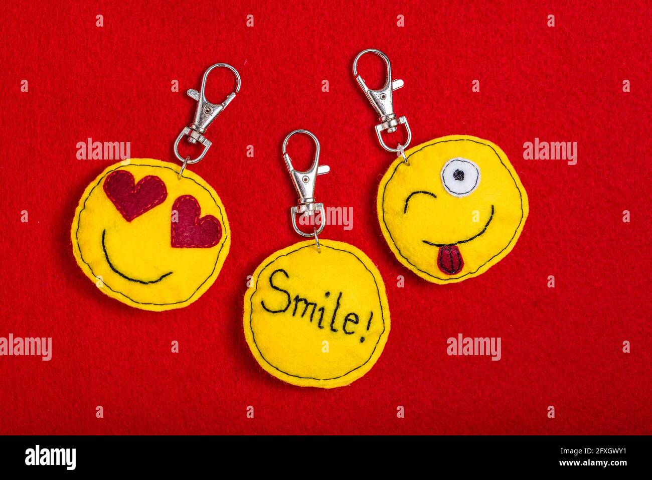 Yellow laughing happy smiley key rings - emoticons Stock Photo - Alamy