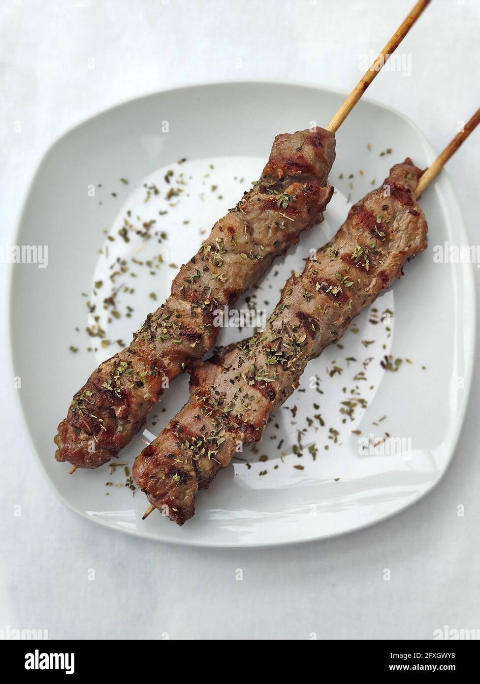 Greek traditional food with meat and vegetables in blue plate trendy ...