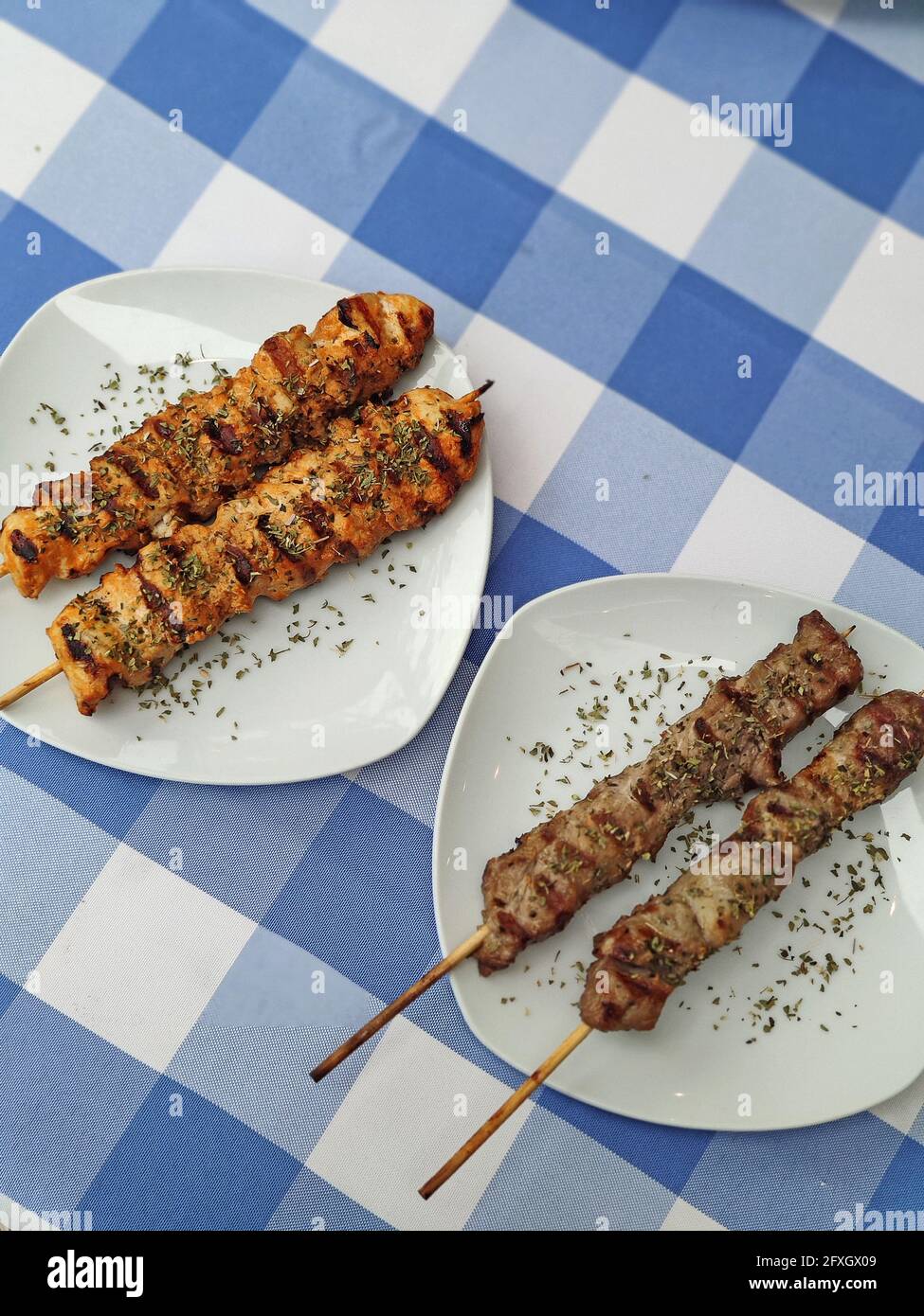 Greek traditional food with meat and vegetables in blue plate trendy ...