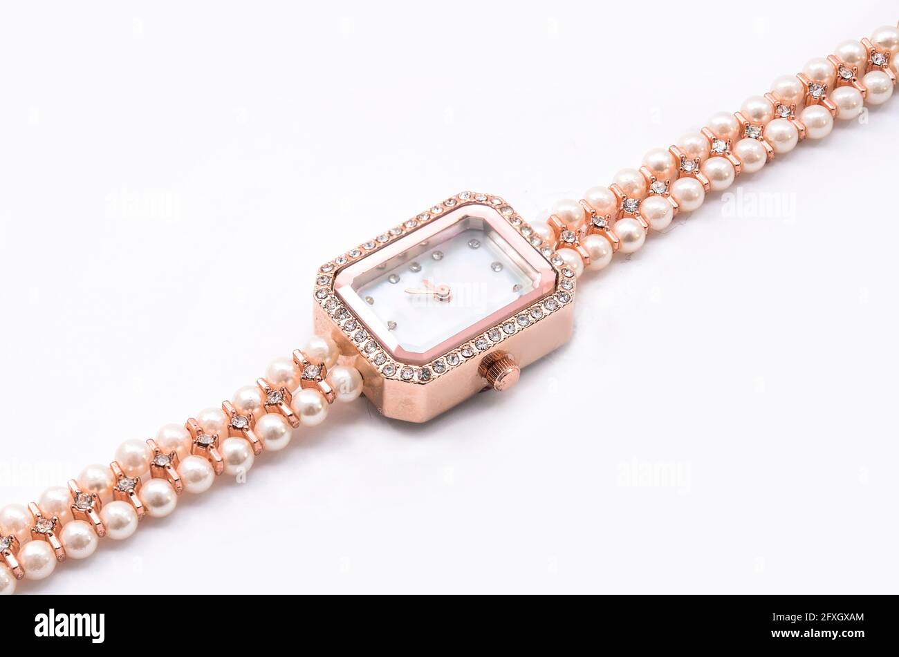 women wristwatches with pearls on a white background Stock Photo - Alamy