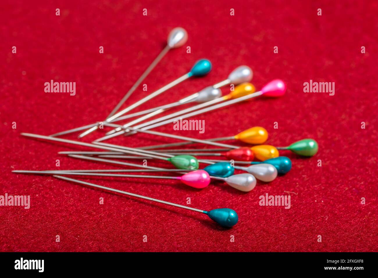 Colorful sewing pin - sewing accessories on textile background Stock ...