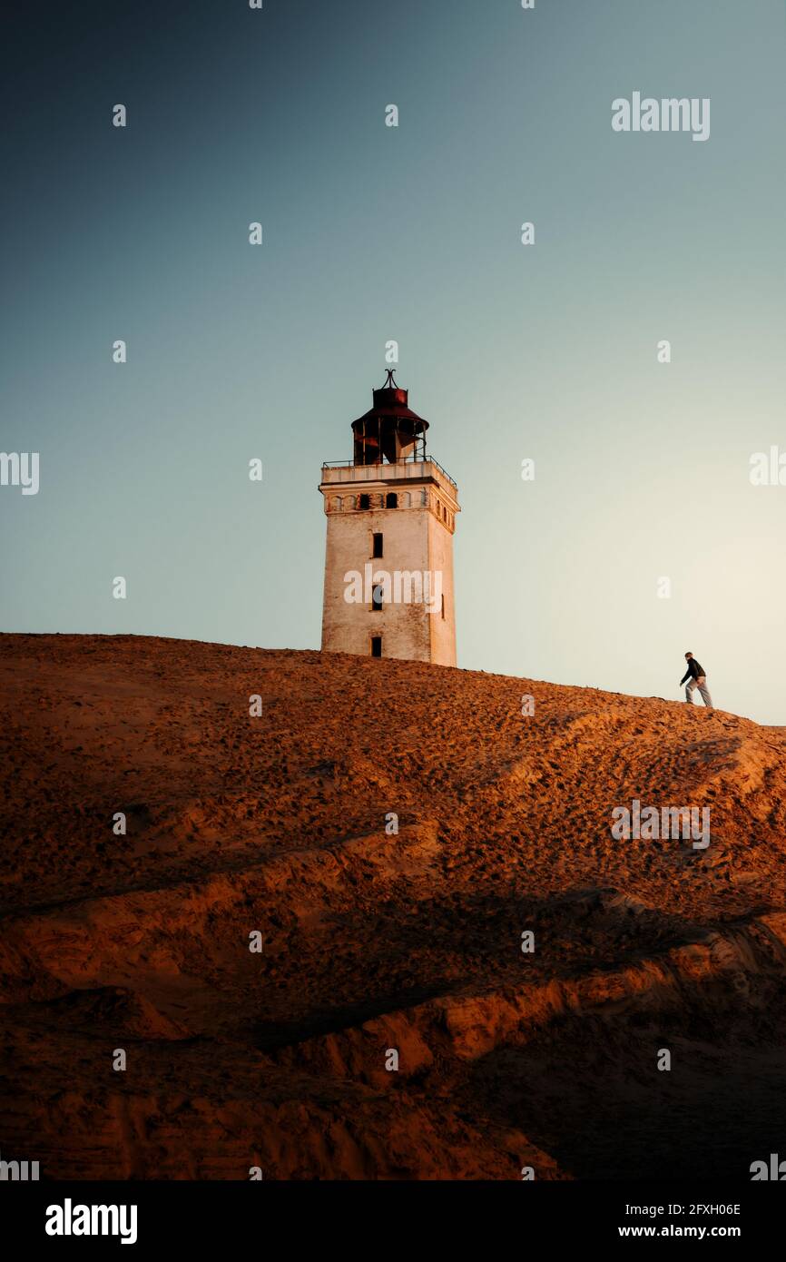 A lighthouse on sand dunes Stock Photo - Alamy