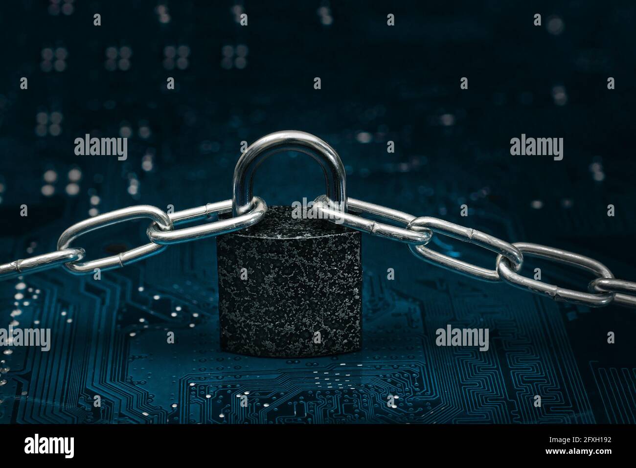 locked padlock with chain on computer motherboard Stock Photo - Alamy