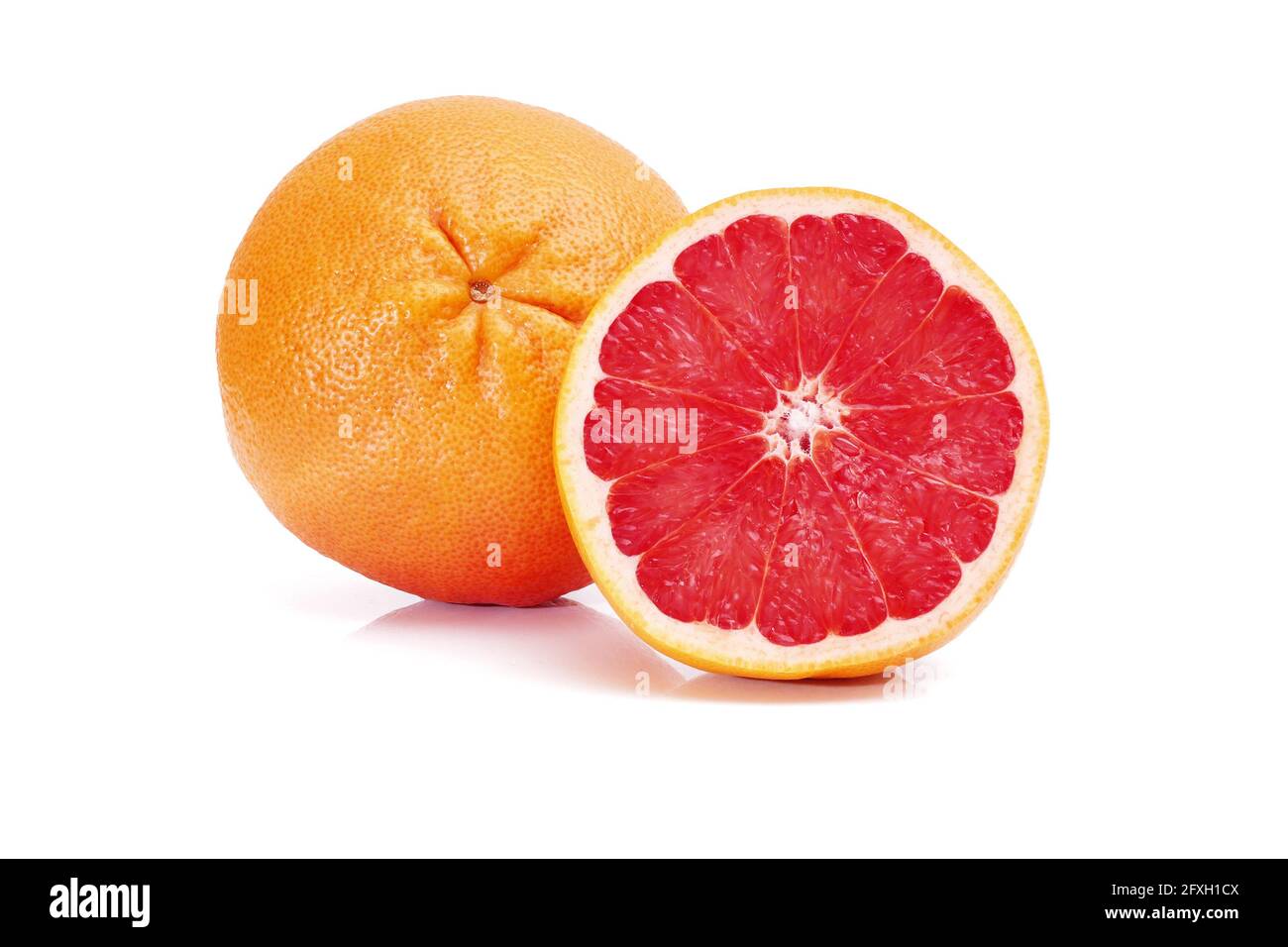ripe grapefruit and half isolated on white background Stock Photo - Alamy