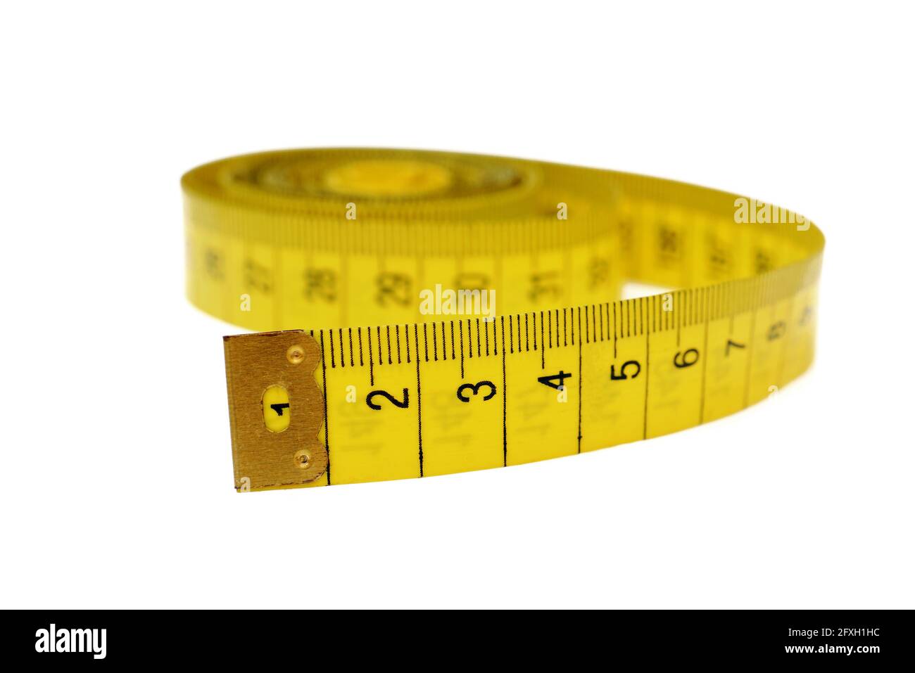 macro of rolled yellow measure tape isolated on white background Stock ...