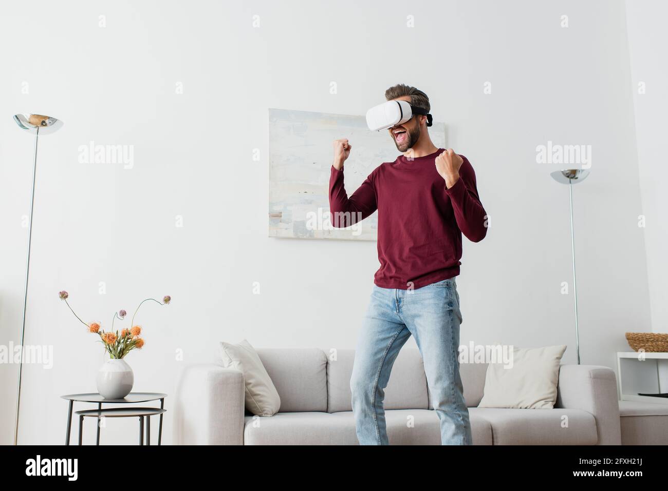 excited man in vr headset shouting while showing triumph gesture Stock ...
