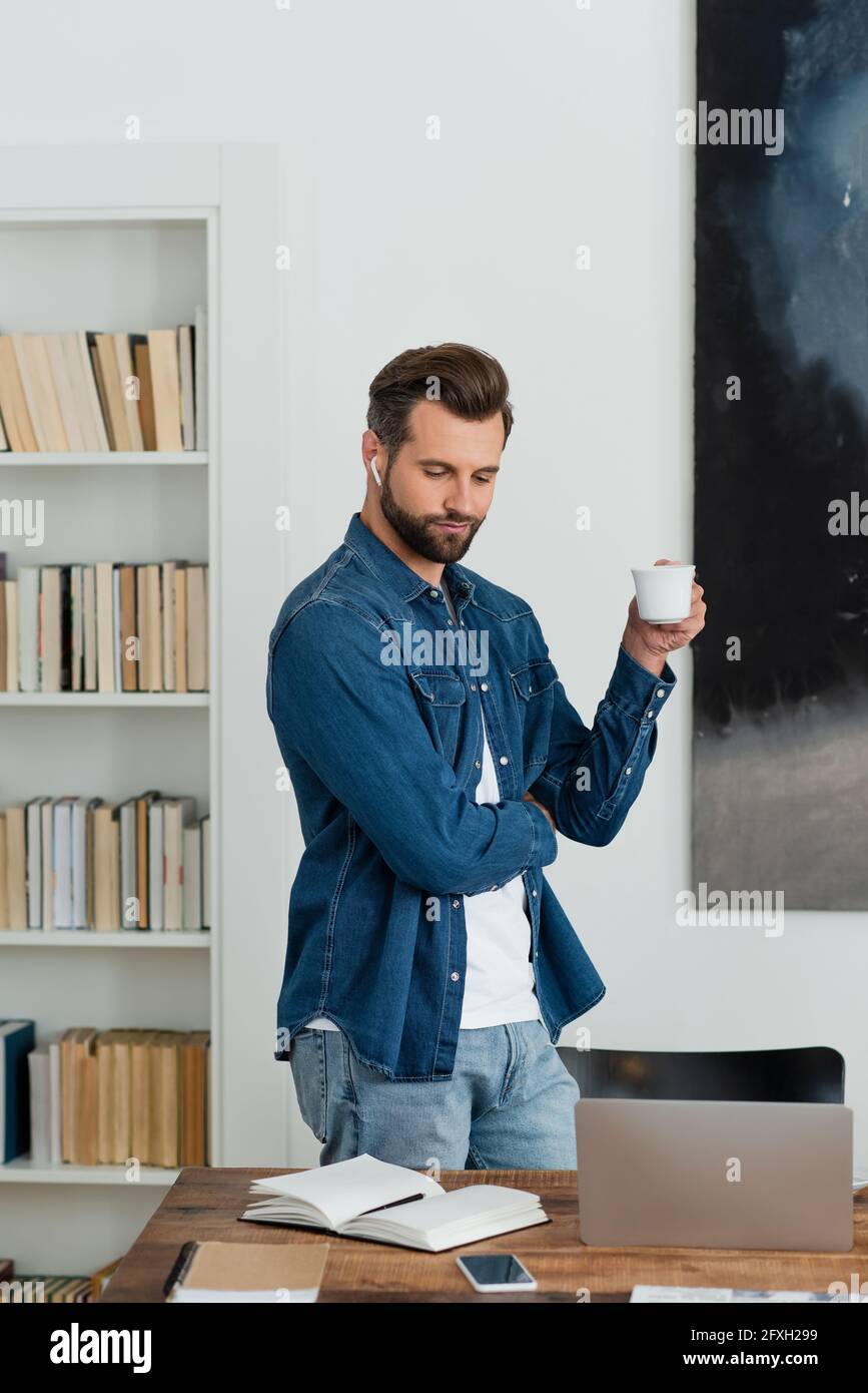 Teleworker in denim shirt hi-res stock photography and images - Alamy