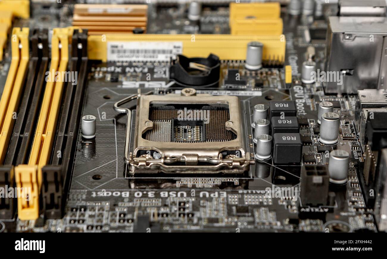 Part of the motherboard with a processor socket and other connectors to ...