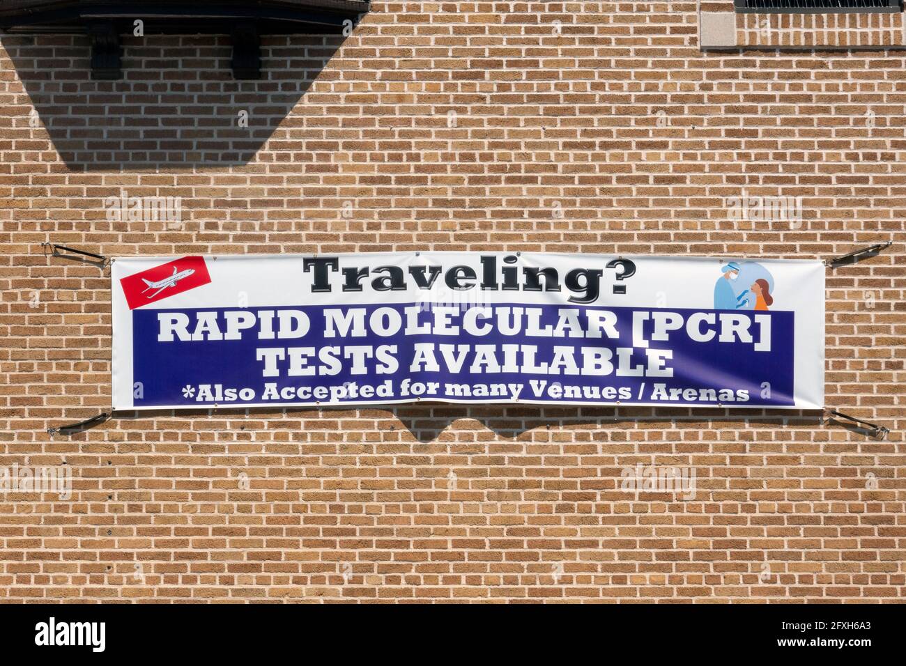 A sign outside a pharmacy in Whitestine, Queens offering Rapid ...
