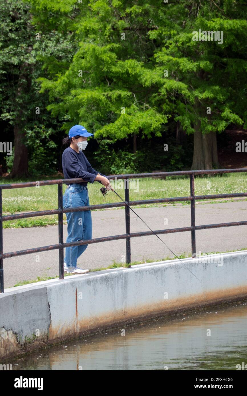 Asian woman fishing hi-res stock photography and images - Alamy